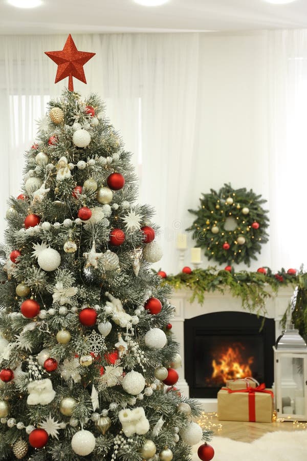 Beautiful Christmas Tree with Star Topper in Decorated Room Stock Photo ...