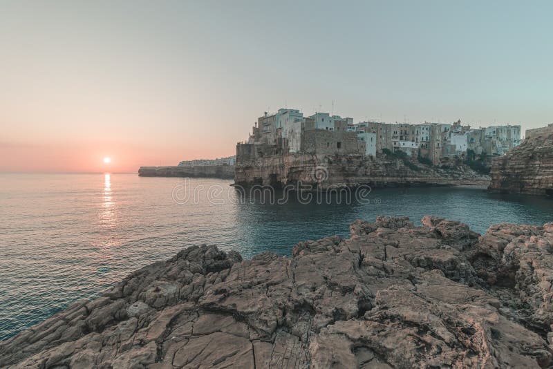 Beautiful City on a Cliff by the Sea with the Sun Setting in the ...