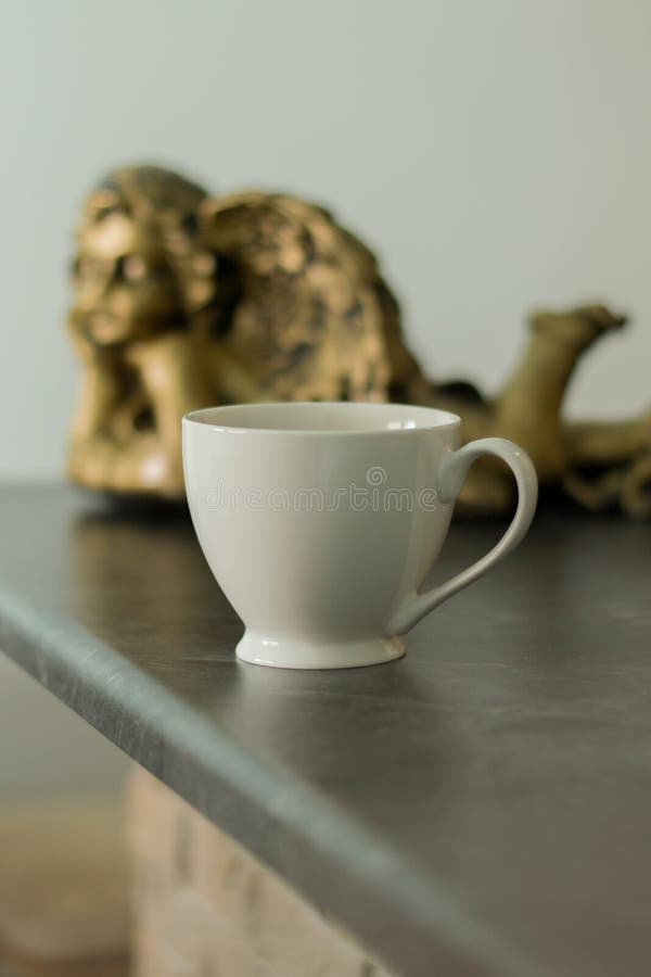 Beautiful and Classic Ceramic White Cup on a Black Surface Stock Image ...