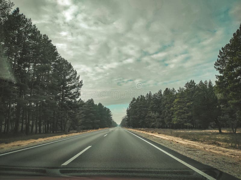 Beautiful Clean Smooth Road. Cloudy Sky and Forest Around Stock Photo ...