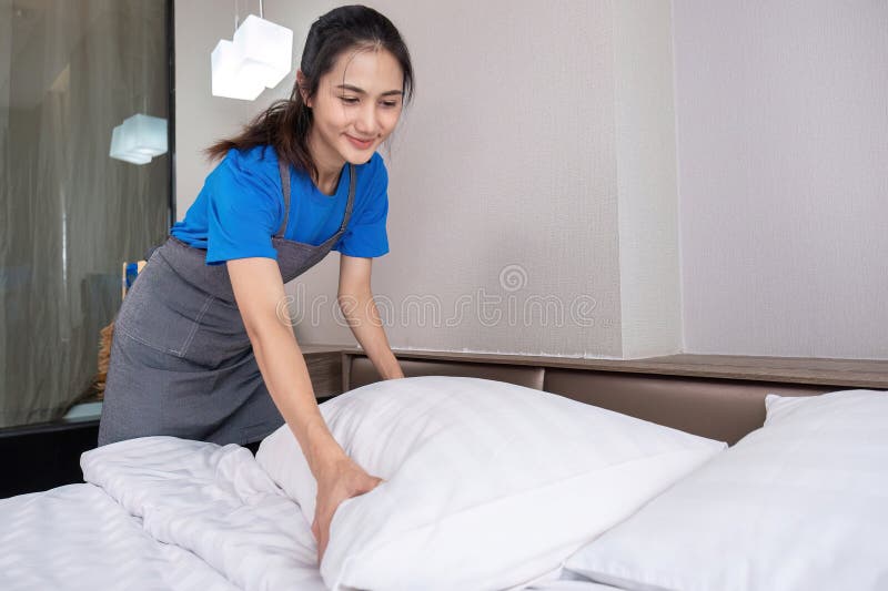 Beautiful Cleaning Lady Clean and Prepare the Bedding on the Bed ...