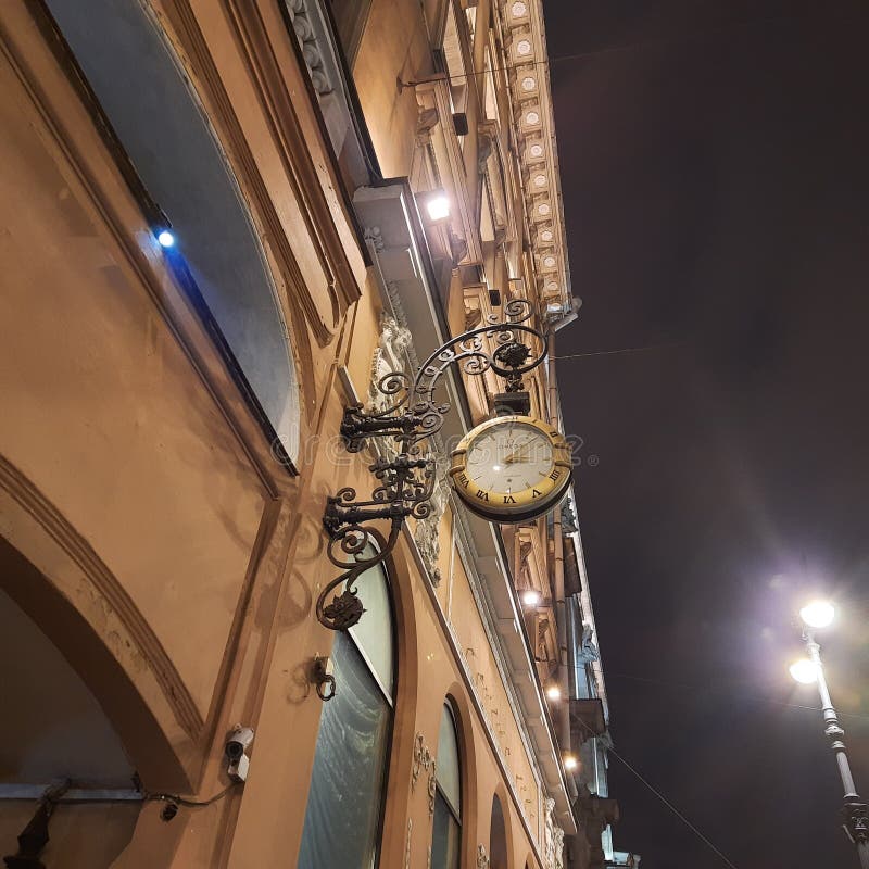 Beautiful clocks at night stock image. Image of lights - 235619105