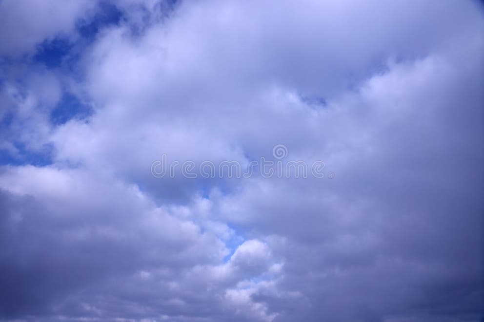 Beautiful Cloud Formations in the Sky with Sunlight Behind. White Clouds on Dramatic Blue Sky ...