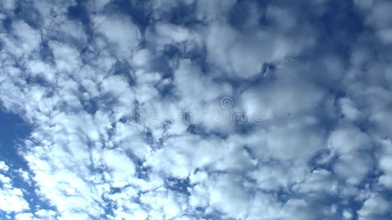 Beautiful Cloud Patterns Fill the Blue Sky Over a Serene Landscape during Stock Footage - Video ...
