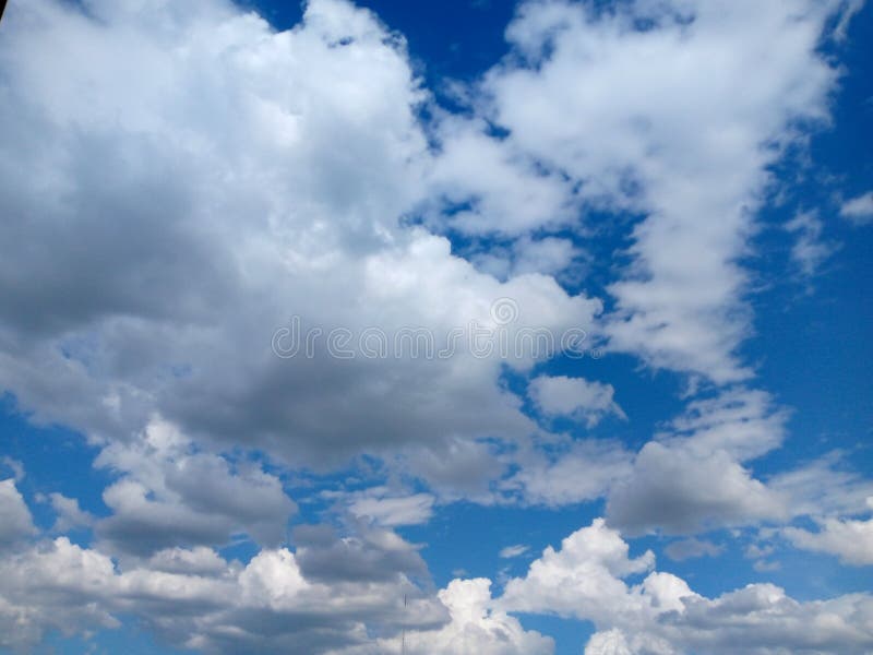 Beautiful Clouds Form a Clear Sky Stock Photo - Image of form, clouds ...