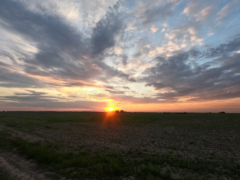 Beautiful Cloudy Sunset in the Countryside Field. Rural Sunset Stock ...