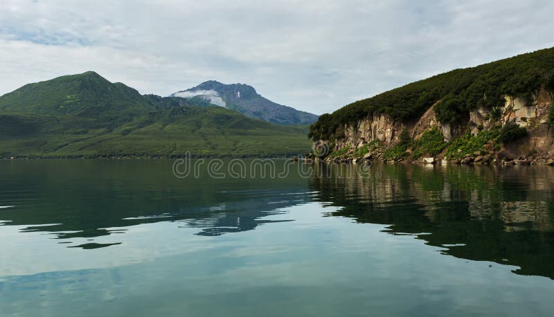 Beautiful Coast of Kurile Lake is Reflected in the Water. Stock Photo ...