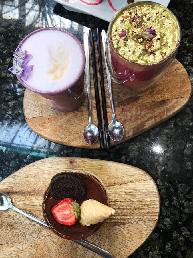 Beautiful Coffee with Violets and Roses in the Cafe Stock Photo - Image ...