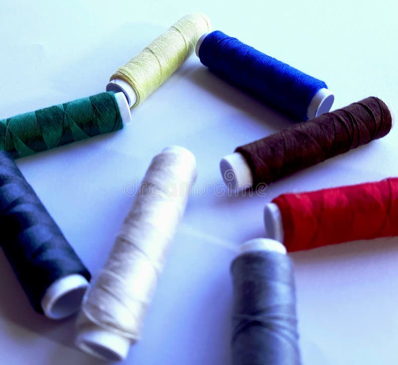 Beautiful Colored Threaded Bows, Tailoring Needles and Colored Thread ...