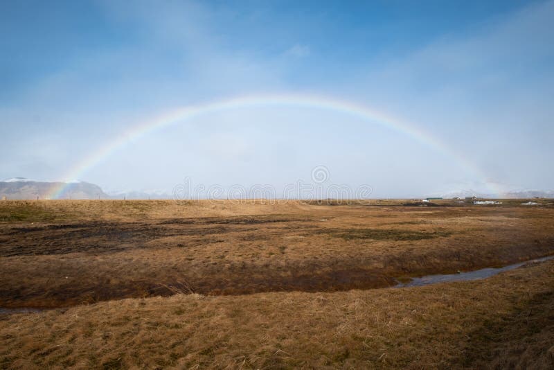 Beautiful and Colorful Rainbow Over the Grass Field Stock Image - Image ...