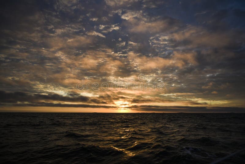 Beautiful Colorful Sunset with Clouds on the North Sea, Summer Stock ...