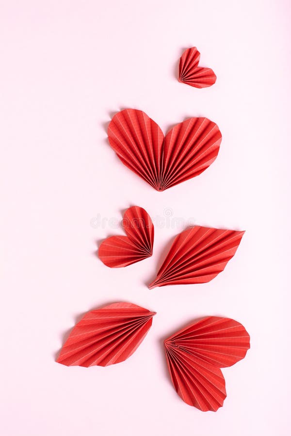 Beautiful Composition of Folded Red Paper Hearts and Leaves on a Pink ...