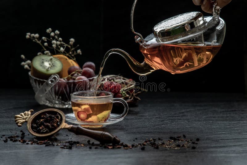 A Beautiful Composition with Hot Fruit Tea is Poured from the Glass ...