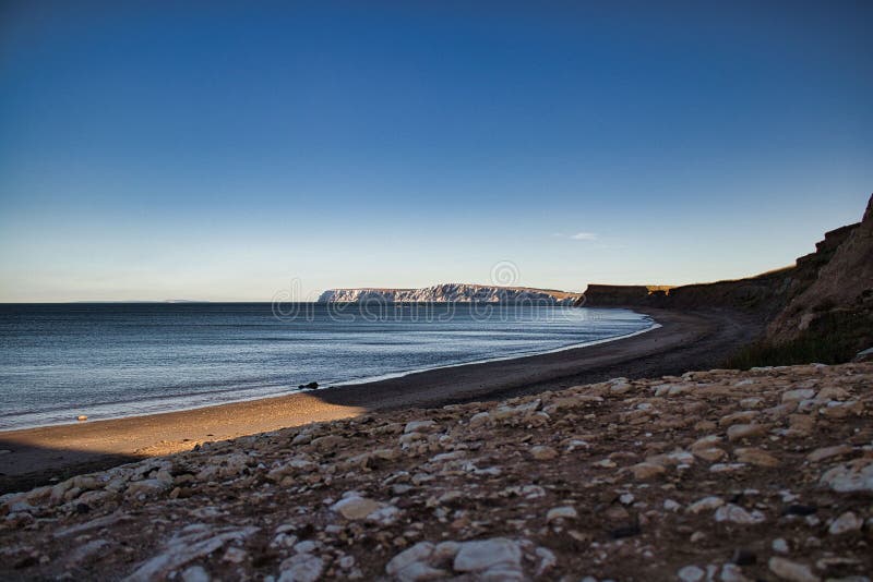 Beautiful Compton Beach with Calm Waves Under a Blue Sky Stock Photo ...