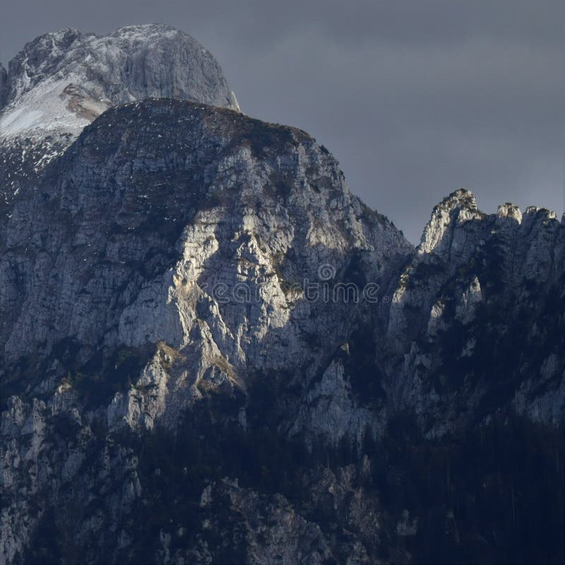 A Cone of Light Appears between Two Mountains Stock Image - Image of ...