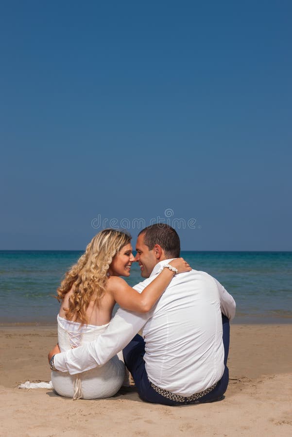 Beautiful Couple at the Beach Stock Image - Image of blue, casual: 80230519