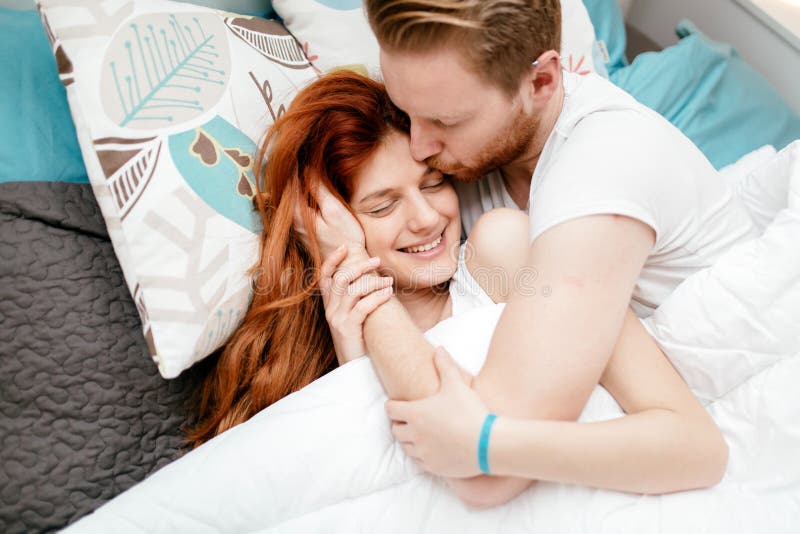 Beautiful couple in bed stock image. Image of affection - 64782919