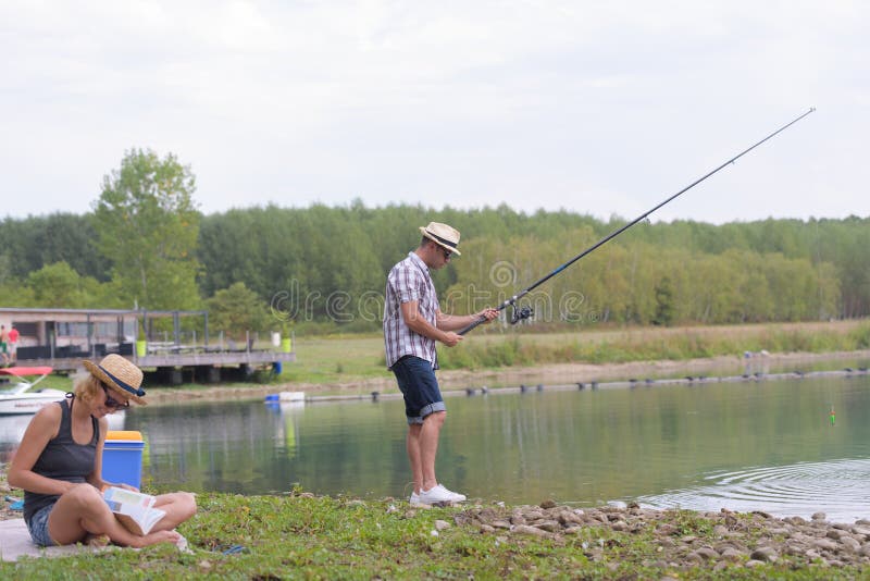Beautiful Couple Catching Fish Stock Image - Image of female, fish ...