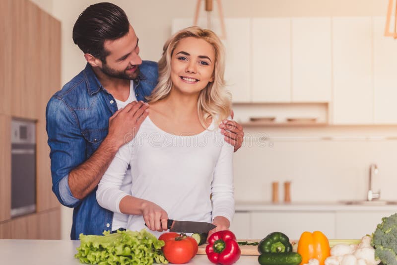 Beautiful couple cooking stock photo. Image of female - 89787166