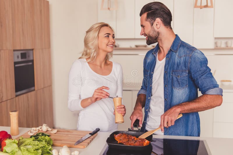 Beautiful couple cooking stock photo. Image of attractive - 89787756
