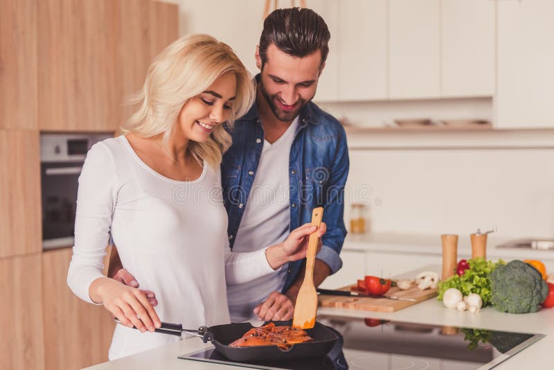 Beautiful couple cooking stock image. Image of girl, drink - 89787859