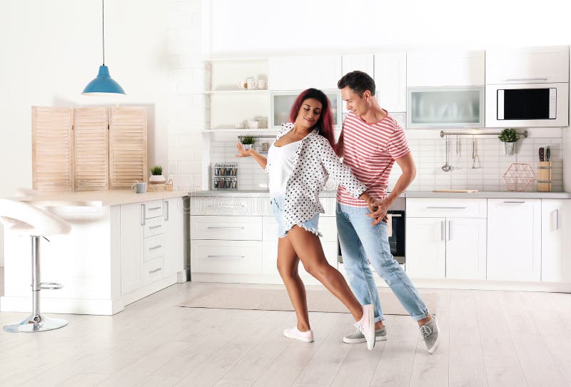 Beautiful Couple Dancing in Kitchen Stock Photo - Image of energy ...