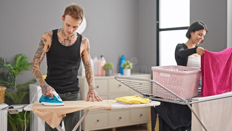 Beautiful Couple Doing Chores Together at Laundry Room Stock Photo ...