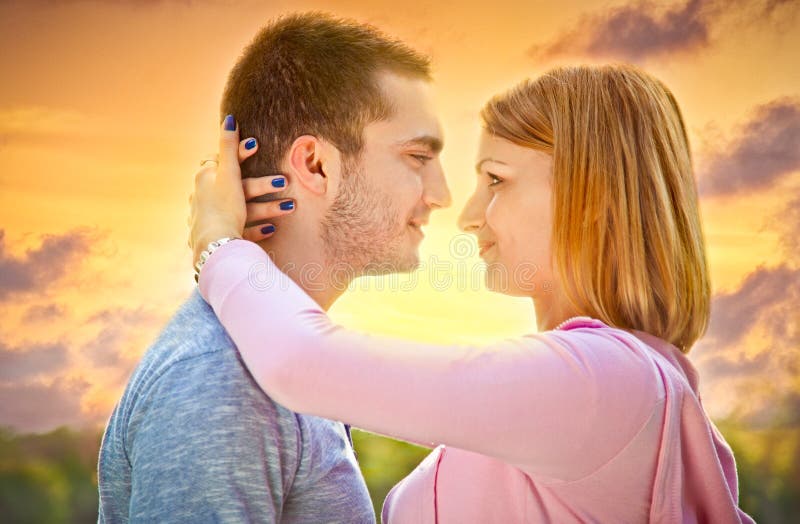 Beautiful Couple Embracing on Date in Sunset Stock Image - Image of ...