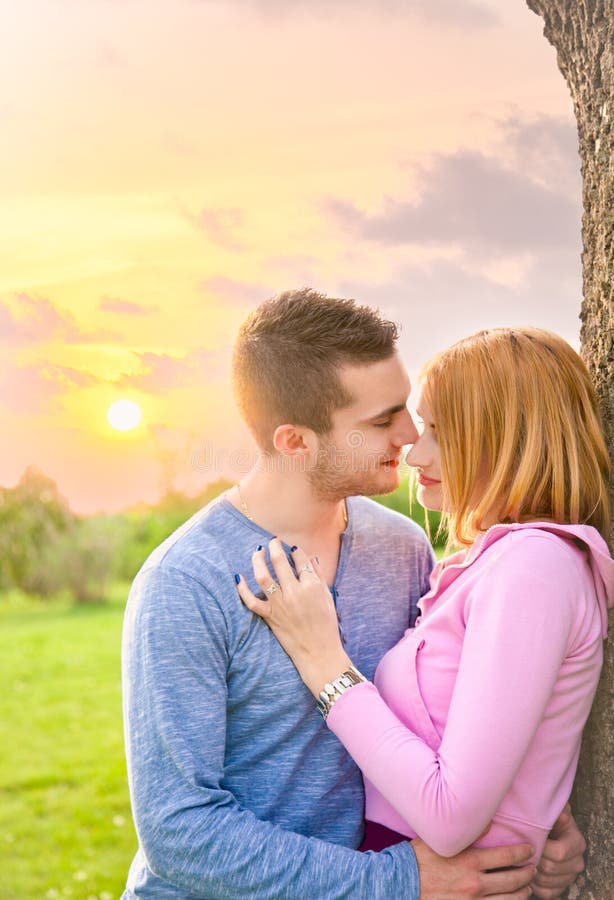 Beautiful Couple Embracing on Date in Sunset Stock Photo - Image of ...