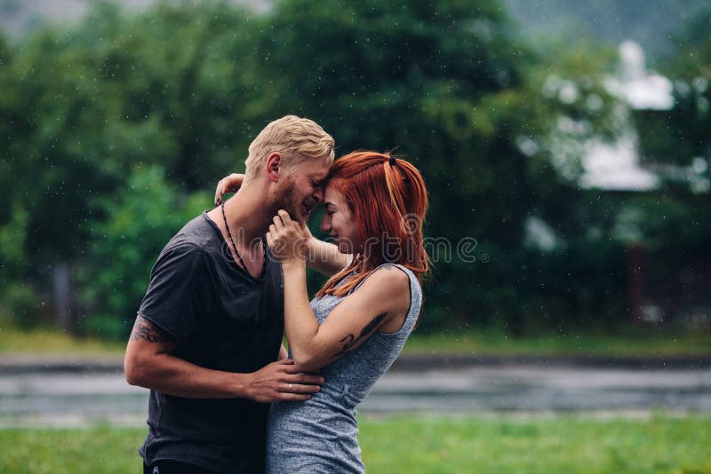 Beautiful Couple Hugging in the Rain Stock Photo - Image of smile ...