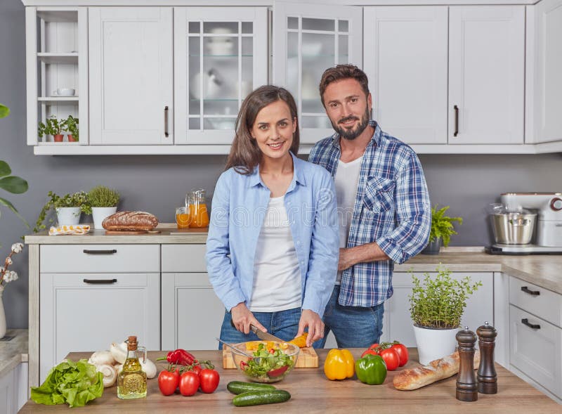 Beautiful Couple Making Dinner Stock Photo - Image of adult, males ...