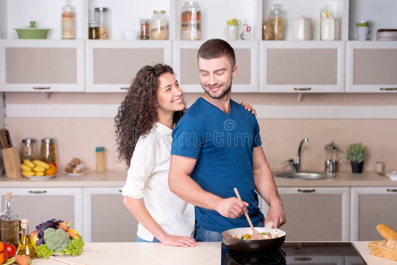 Beautiful Couple Preparing Supper and Looking at Stock Image - Image of ...