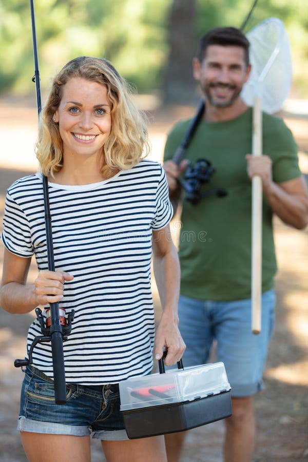 Beautiful Couple with Rods Going Fishing Stock Photo - Image of road ...