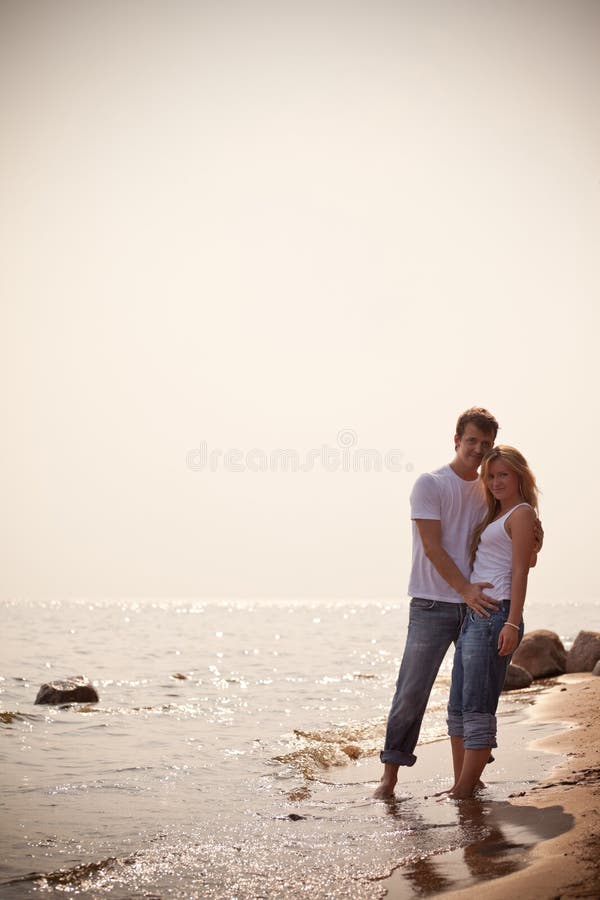 Beautiful Couple on a Seashore Stock Photo - Image of holidays, happy ...