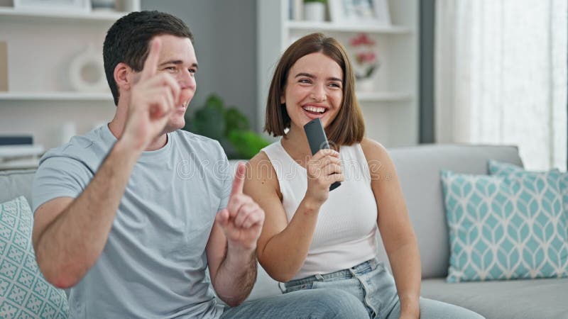 Beautiful Couple Singing Song Using Tv Remote Control As a Microphone ...