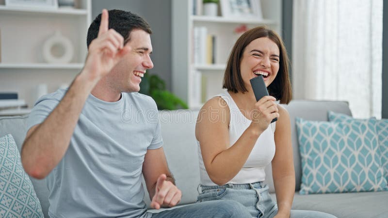 Beautiful Couple Singing Song Using Tv Remote Control As a Microphone ...