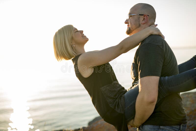 Beautiful Couple at the Sunset Habing Fun on Seaside Stock Image ...