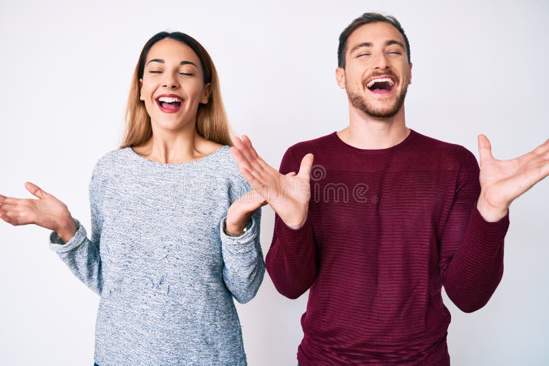 Beautiful Couple Wearing Casual Clothes Celebrating Mad And Crazy For