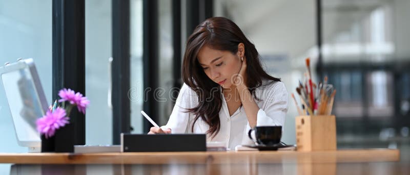 Creative Woman Working on Project with Digital Tablet at Modern ...