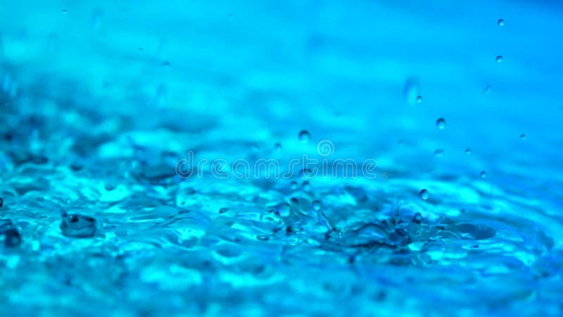 Beautiful Crystal Clear Blue Lighted Water Surface, Drops Falling from ...