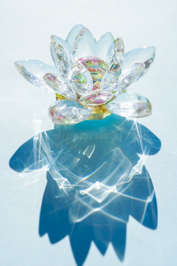 Beautiful Crystal Lotus Flower on a Blue Sunny Table Stock Photo ...