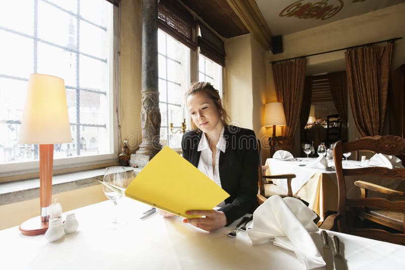 Beautiful Customer Reading Menu at Restaurant Table Stock Image - Image ...
