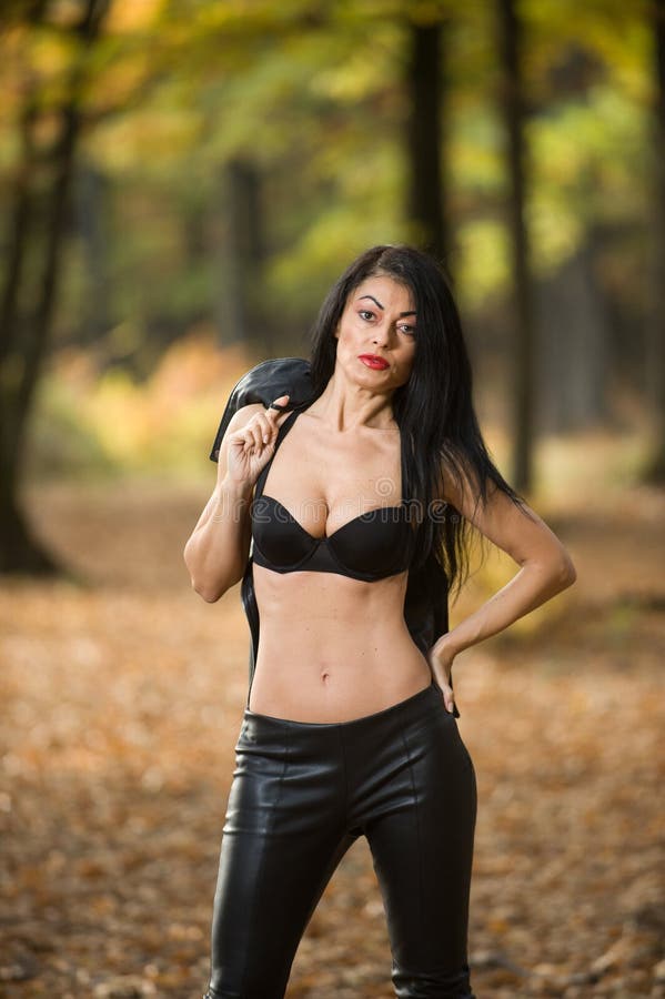 Beautiful Dark Haired Young Woman Wearing A Black Bra Leather Jacket