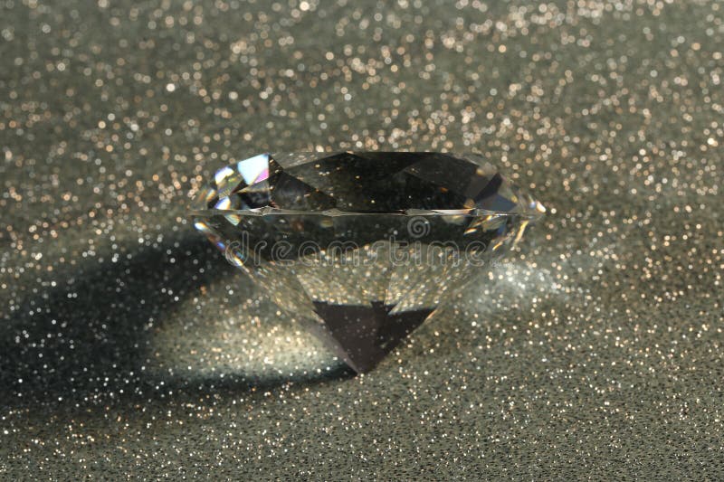 Beautiful Dazzling Diamond on Glitter Background, Closeup Stock Image ...