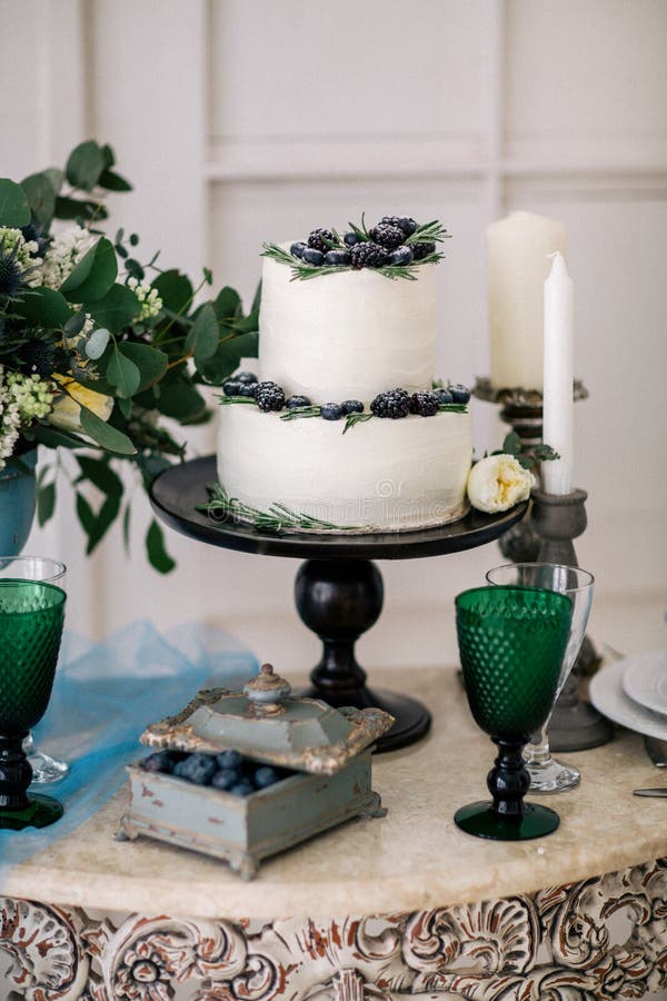 Beautiful Decorate Table with Candles and Wedding Cake on the Table in ...