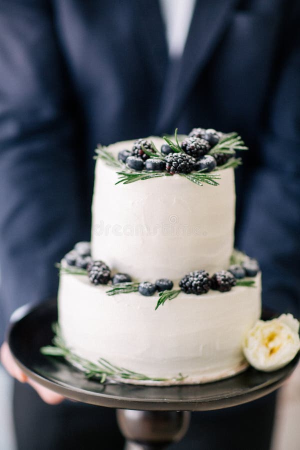 Beautiful Decorate Wedding Cake in Groom Hands Stock Photo - Image of ...