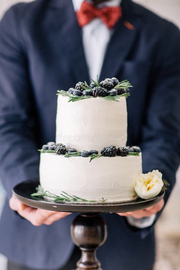Beautiful Decorate Wedding Cake in Groom Hands Stock Photo - Image of ...