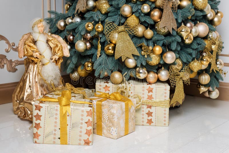 Beautiful Decorated Golden Christmas Tree with Present Boxes in Luxury ...