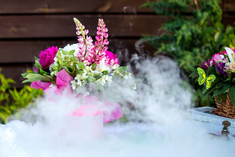 Beautiful Decoration Composition Bouquet on a Table and Dry Ice Smoke ...