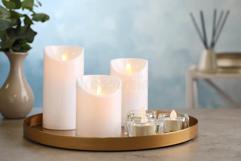 Beautiful Decorative LED Candles on Grey Table Stock Photo - Image of ...